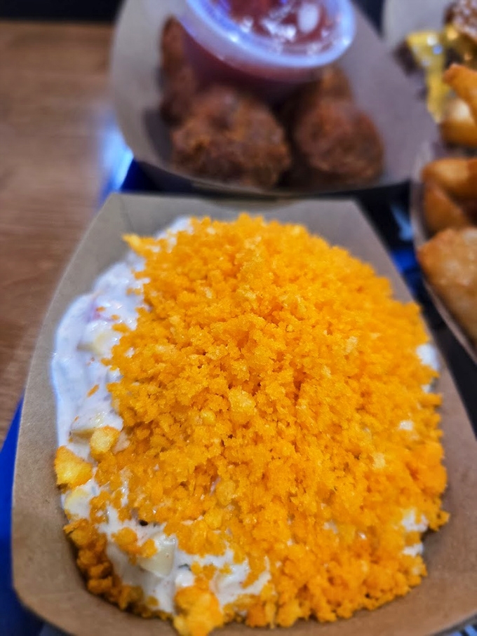 That vibrant orange mountain isn't just cheese—it's a flavor avalanche waiting to descend upon your taste buds with creamy, savory perfection.