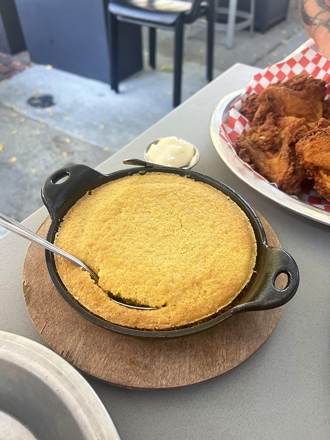 Cornbread that arrives in its own skillet, golden as a summer sunset. One bite with that honey butter and you'll understand why people drive for hours.