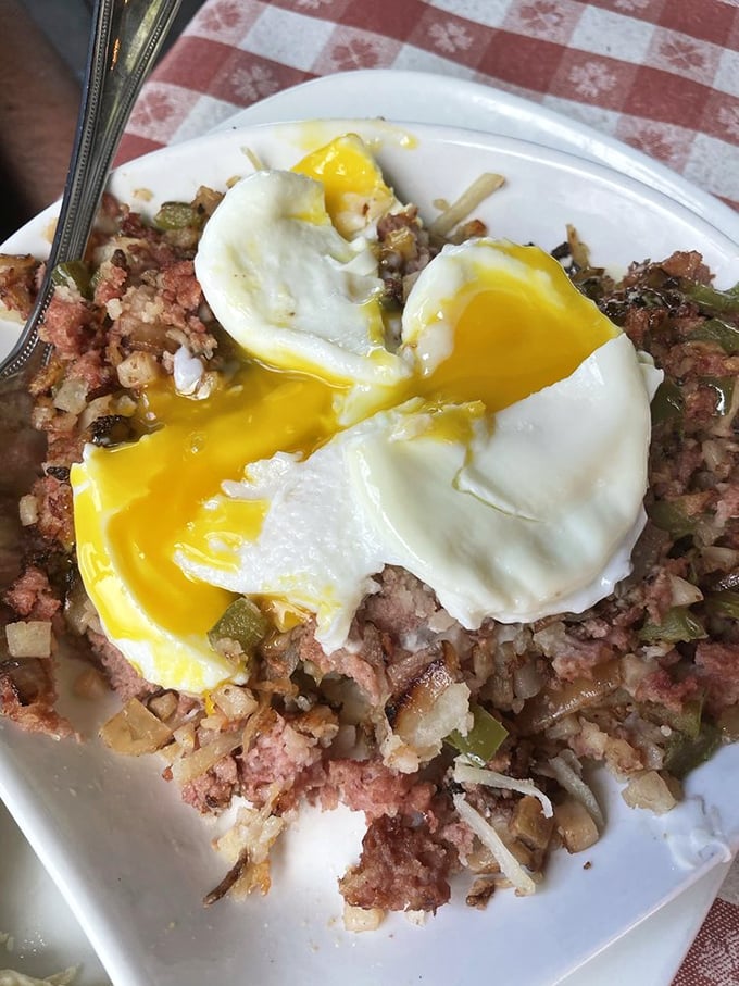 That golden yolk breaking over corned beef hash is basically sunrise happening on your plate in delicious form.