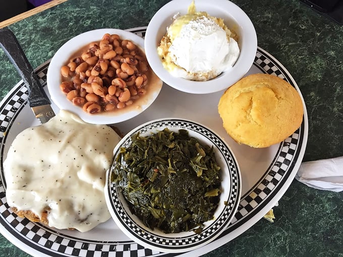Southern comfort on a plate &ndash; where biscuits swim in pepper gravy, collard greens whisper family secrets, and cornbread stands proudly alongside.