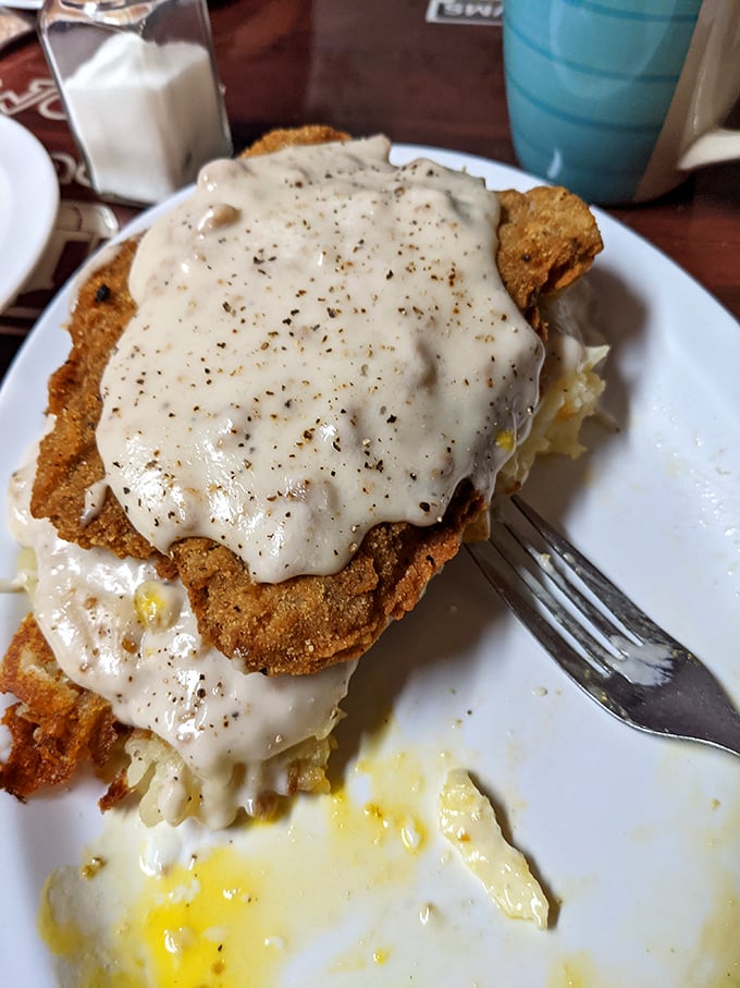 Country fried steak swimming in peppery gravy&mdash;comfort food that hugs your insides like a warm Midwestern handshake.