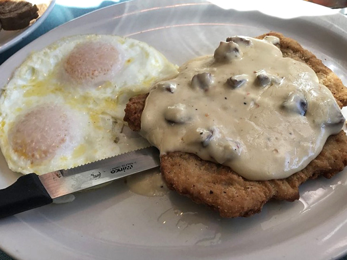 Country fried pork with mushroom gravy and eggs&mdash;because some mornings require more fortification than a cup of kale smoothie could ever provide.
