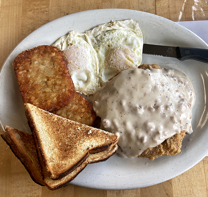 Country fried steak smothered in peppery gravy alongside sunny-side-up eggs and golden toast&mdash;the breakfast trifecta that fuels Connecticut's finest.