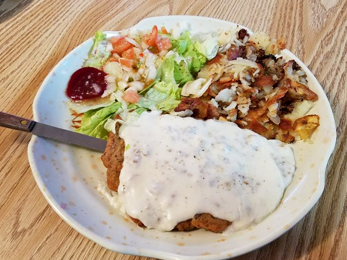 Country fried steak swimming in peppery gravy&mdash;the kind of dish that makes you want to hug the cook and thank them for not counting calories.
