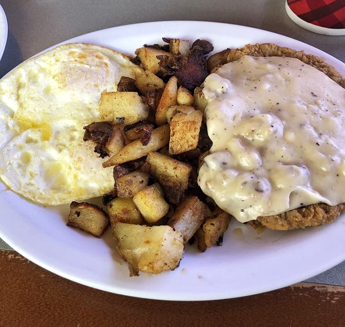 Country fried steak with eggs and potatoes &ndash; the breakfast equivalent of a warm hug from your favorite aunt who never counted calories.