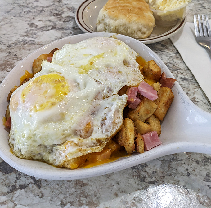 The Country Skillet &ndash; where eggs, potatoes, and ham unite in a cast iron symphony that would make your cardiologist wince and smile.