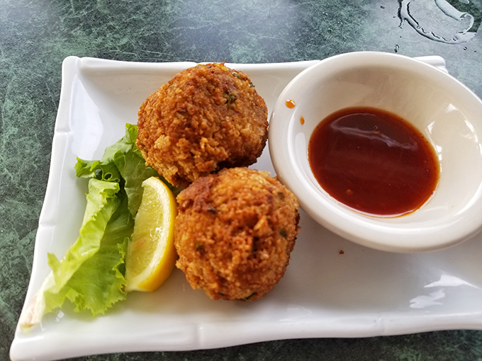 Crab balls that could make a seafood skeptic weep with joy &ndash; crispy outside, succulent inside, and served with a sauce that means business.