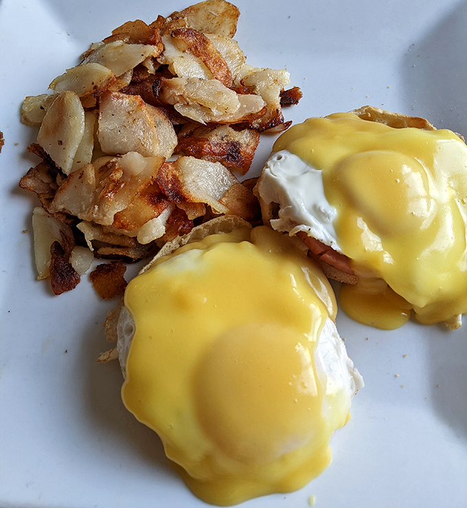 Eggs Benedict with hollandaise that flows like liquid gold. Whoever said "you can't buy happiness" clearly never had this for breakfast.