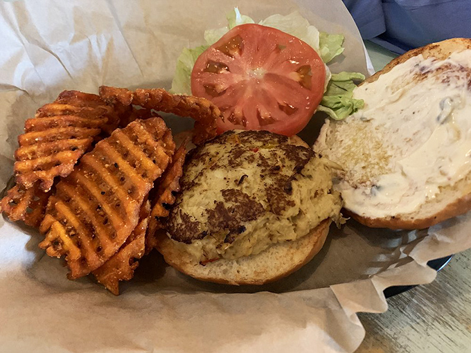 This isn't just a sandwich &ndash; it's architecture. A perfectly seared crab cake with the structural integrity to support your seafood dreams.