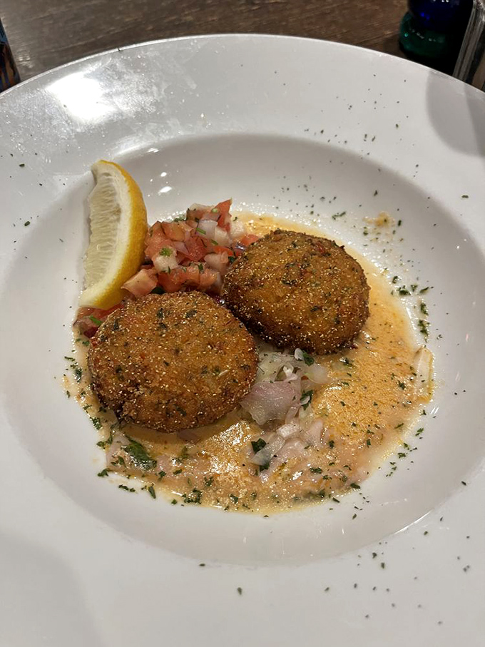 These aren't your average crab cakes &ndash; they're mostly actual crab, not breadcrumbs with vague oceanic memories. That sauce? You'll be dreaming about it later.