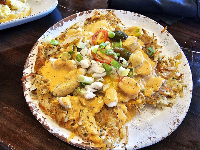 Hash browns transformed into an art form with crab, veggies, and a sauce that makes you want to write thank-you notes to the chef.