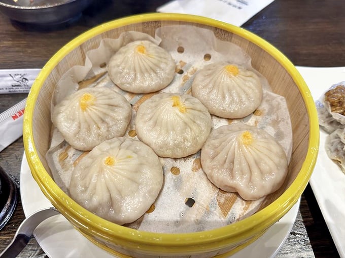 Soup dumplings: the magic trick of Chinese cuisine where somehow liquid stays inside until that first glorious bite releases the flavor flood.