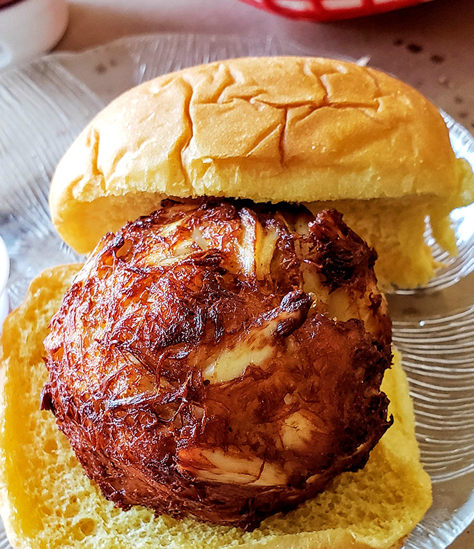 A crab cake sandwich so generous, it's practically spilling its secrets all over the plate.