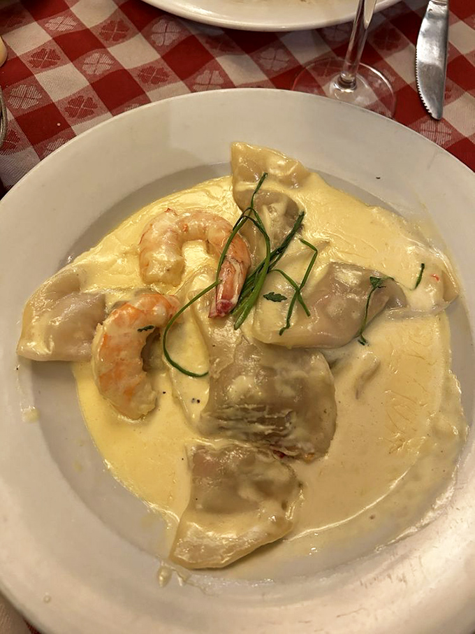 Seafood-stuffed ravioli swimming in cream sauce&mdash;proof that sometimes the most beautiful performances happen on a plate rather than a stage.