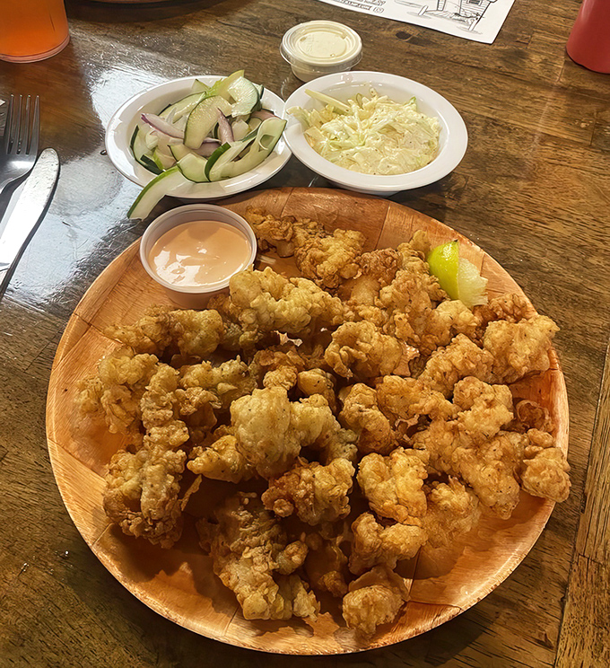 Cracked conch that transforms a chewy sea creature into golden, tender morsels of joy. The cucumber salad and coleslaw provide the perfect counterpoint.