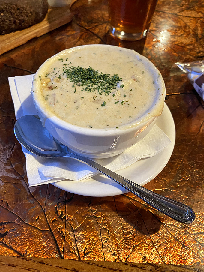 Cream of crab soup so velvety rich it should come with its own warning label. Spoon-coating decadence topped with fresh herbs.