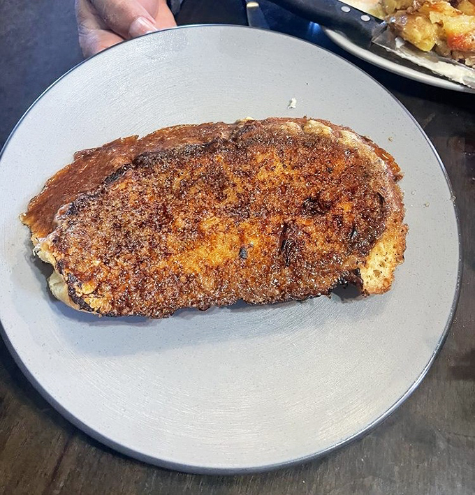 This French toast appears to have been kissed by fire and blessed by butter. Resistance is futile.