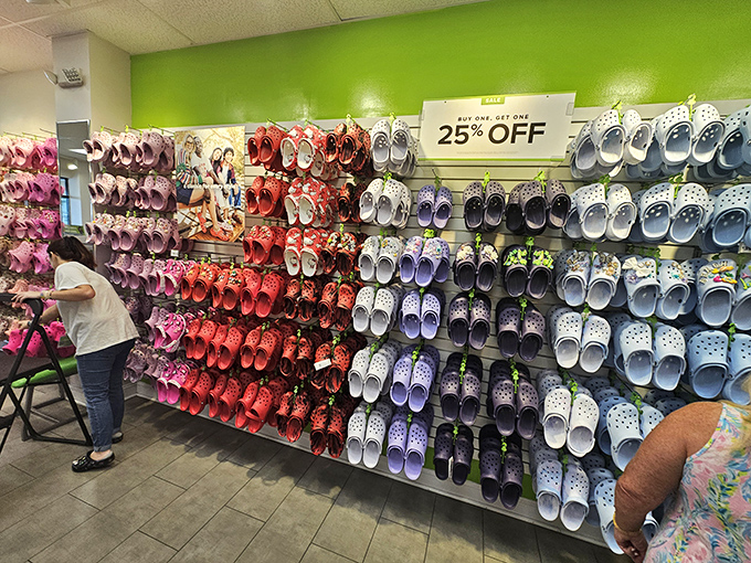 The wall of Crocs presents a rainbow of comfort possibilities&mdash;because nothing says "I've officially embraced vacation mode" like rubber footwear in every color of the sunset.