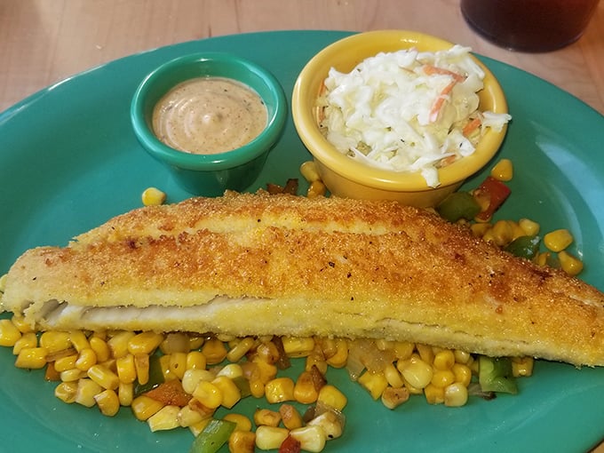 This crusted fish fillet resting on sweet corn succotash isn't just lunch—it's edible evidence that diners can do sophisticated just as well as simple.