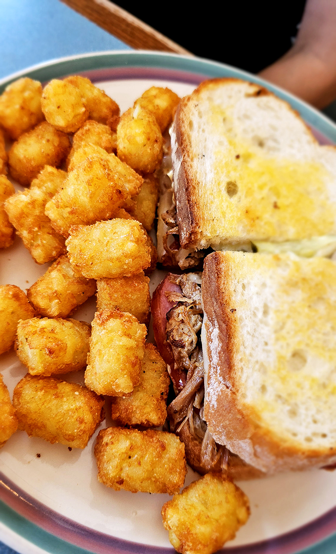 The Cuban sandwich with those perfectly golden tater tots &ndash; a lunch combination that makes you question why you ever waste calories on lesser meals.