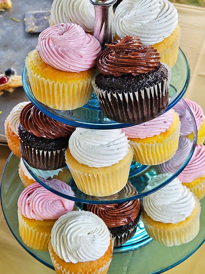 These cupcakes aren't just stacked&mdash;they're strategically tiered for maximum temptation. The pink ones are practically flirting with you.