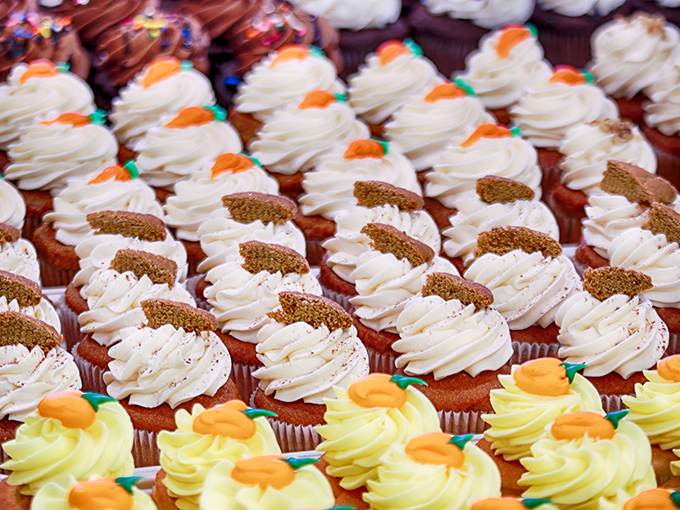 Cupcake perfection lined up like sweet soldiers ready for deployment to your taste buds. Those carrot decorations aren't fooling anyone&mdash;these aren't vegetables.