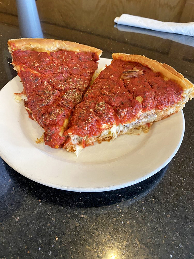 Behold the deep dish in all its glory &ndash; a fortress of flaky crust protecting the molten cheese and tangy sauce treasures within.