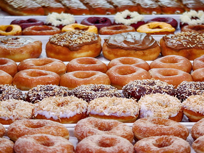 Donut nirvana awaits with rows of hand-crafted perfection. Diet plans enter at their own risk.