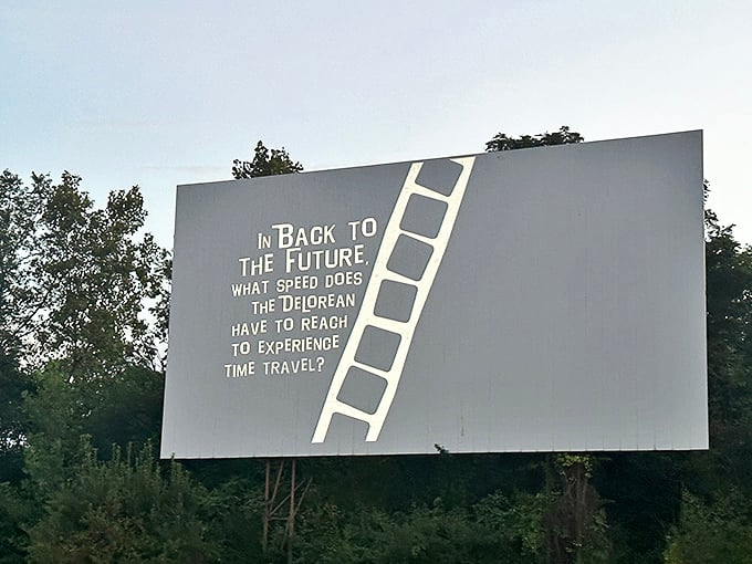 Movie trivia flickers on screen as dusk settles in. The anticipation builds with each passing minute.