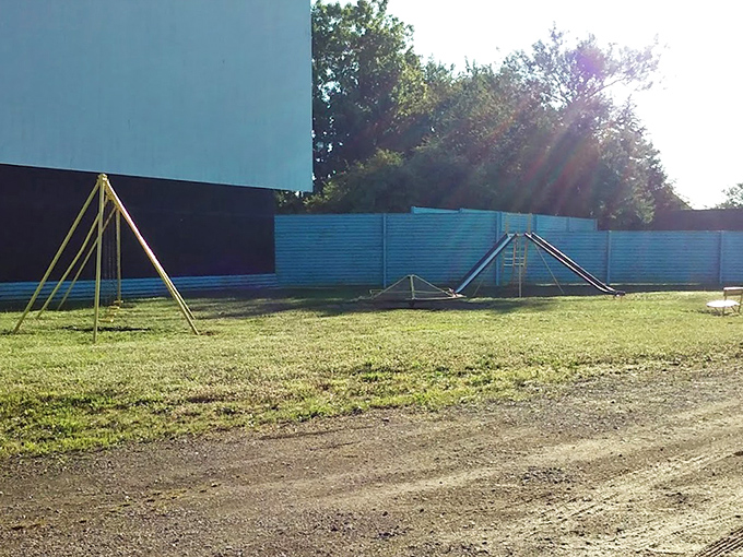 Those yellow swing sets aren't just playground equipment&mdash;they're time machines transporting kids between play and cinema magic.