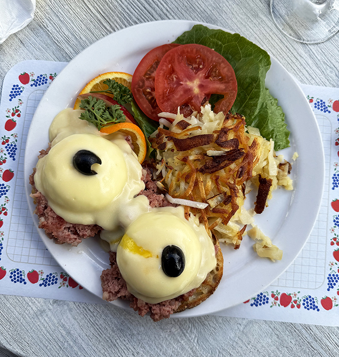 Eggs Benedict done proper: perfectly poached eggs, rich hollandaise, and golden hash browns that understand their crispy assignment completely.