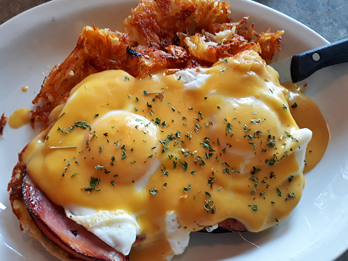 Eggs Benedict reimagined with a golden hollandaise cascade that would make Wordsworth write sonnets about breakfast.