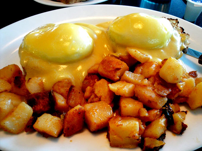 Eggs Benedict that would make any brunch enthusiast weak at the knees&mdash;those golden yolks ready to create their own delicious waterfall.