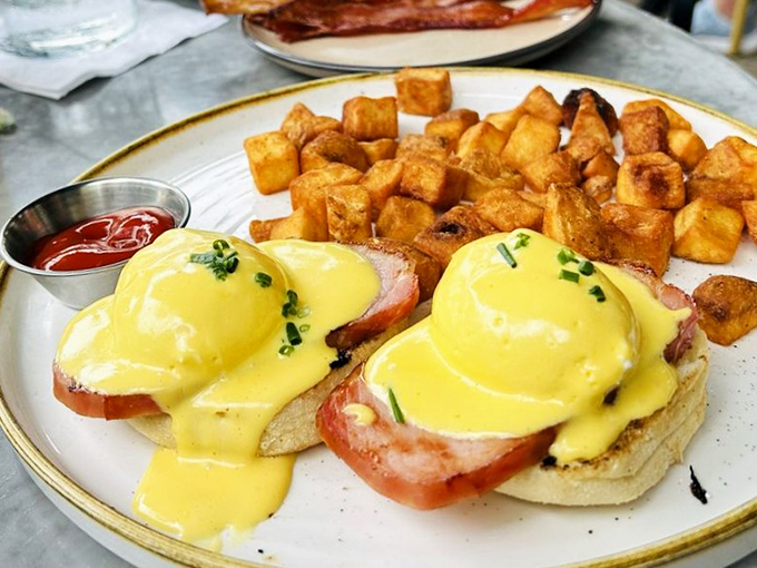 Classic Eggs Benedict executed with the confidence of someone who knows they've mastered the art of breakfast architecture.
