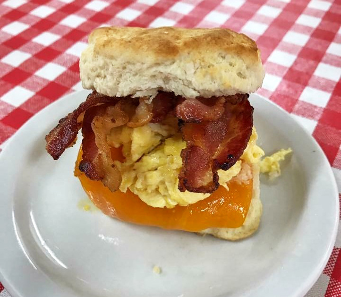 Breakfast perfection: A fluffy biscuit sandwich with eggs, bacon, and cheese that makes hitting the snooze button worth the rush.
