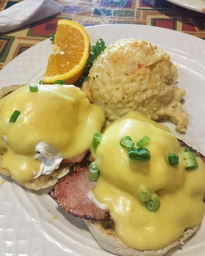 Eggs Benedict done right&mdash;poached eggs perched atop ham like royalty, draped in hollandaise that's basically sunshine in sauce form.