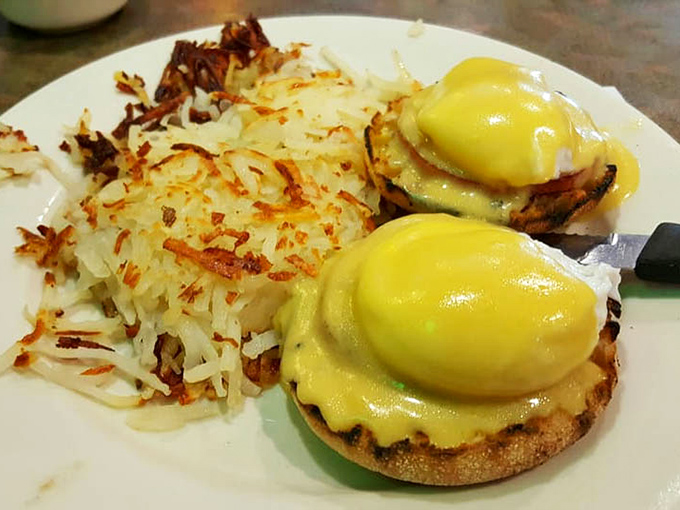 Eggs Benedict done right&mdash;golden hollandaise cascading over English muffins with hash browns crisped to perfection on the side.