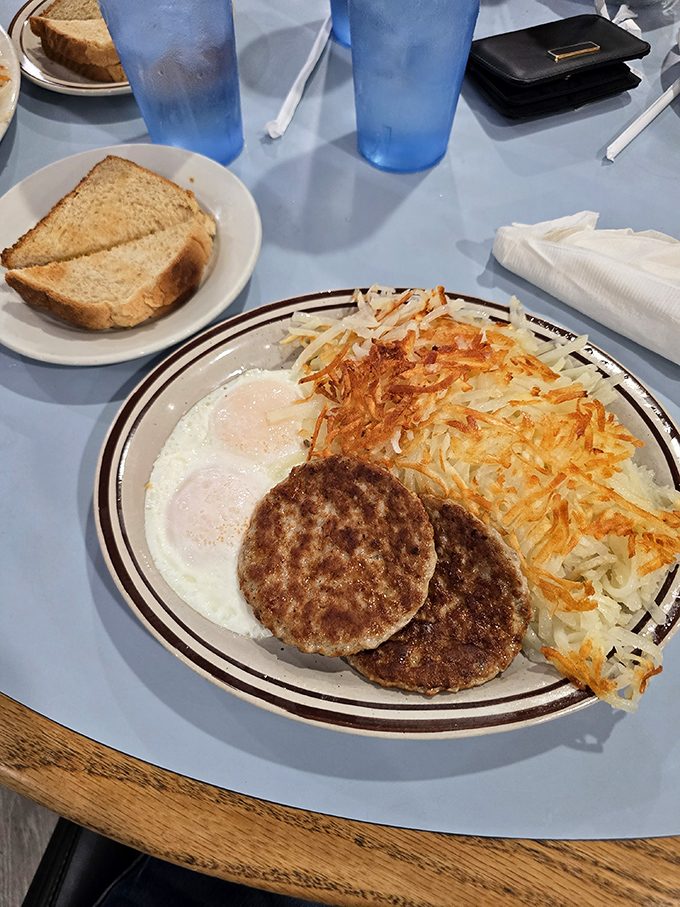 Classic comfort on a plate: eggs, sausage, and hash browns that would make your grandmother proud. 