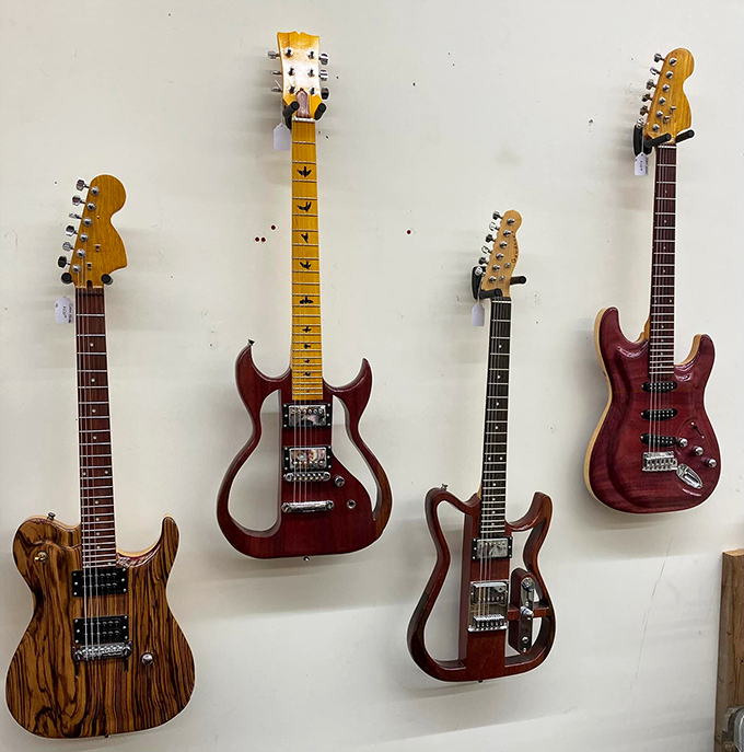 Rock star dreams line the wall with these electric guitars, each silently promising to transform your living room into Madison Square Garden.