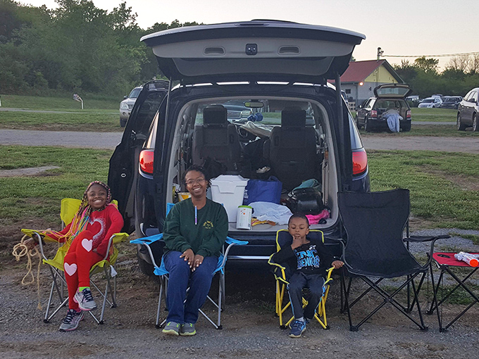 Drive-in veterans know the secret: tailgates make perfect viewing platforms and smiles are always included in the admission price.