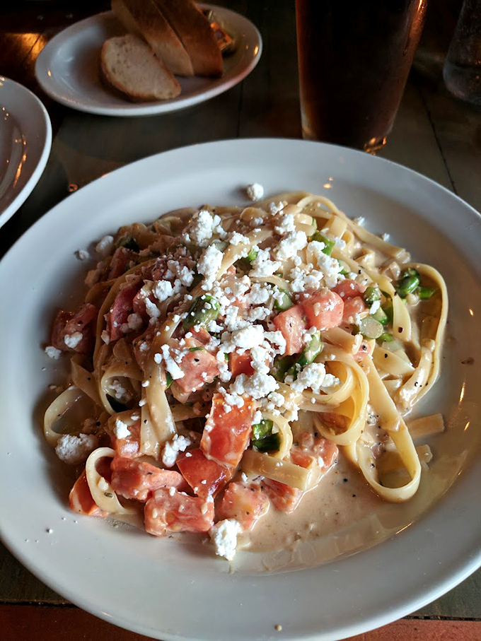 Fettuccine that would make an Italian grandmother weep with joy. Those ribbons of pasta cradling fresh tomatoes and feta are what comfort food dreams are made of.