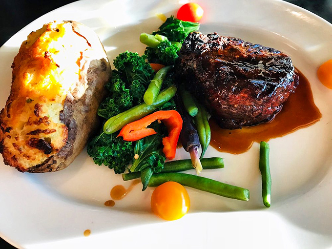 Land meets sea in perfect harmony &ndash; a filet mignon that would make a steakhouse jealous alongside a loaded baked potato that's practically wearing a tuxedo.