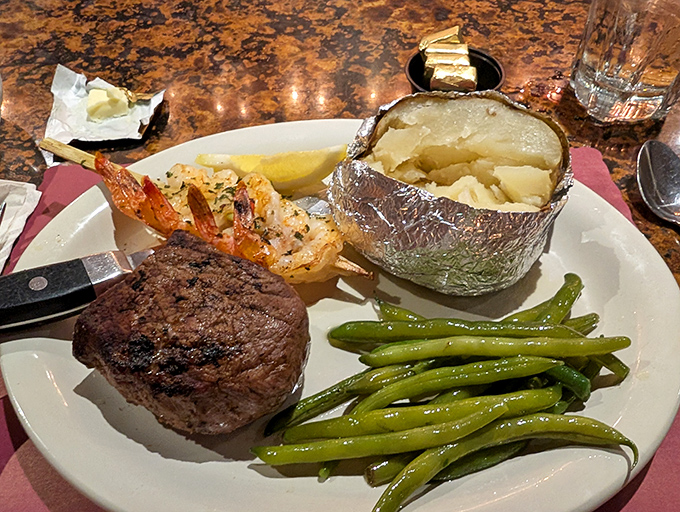 Filet mignon, baked potato, and fresh green beans&mdash;the holy trinity of steakhouse dining that never disappoints the faithful.