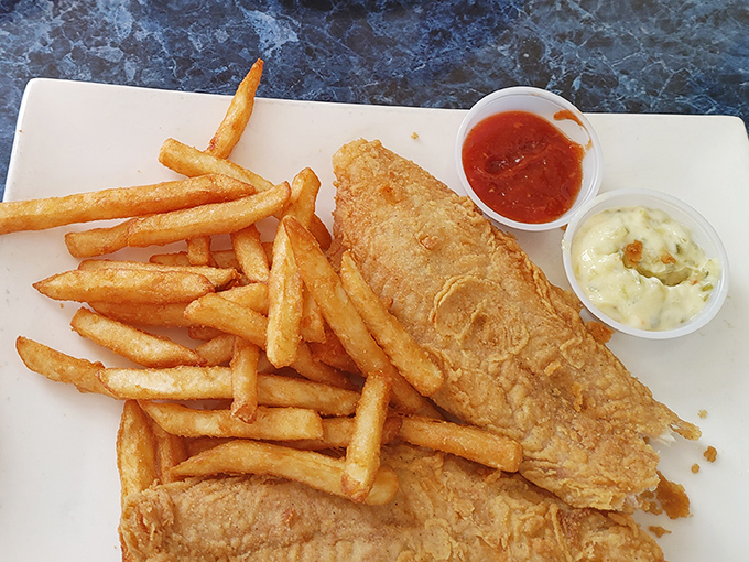 Fish and chips that deliver the perfect crunch-to-flake ratio, served with dipping sauces that make each bite a new adventure.