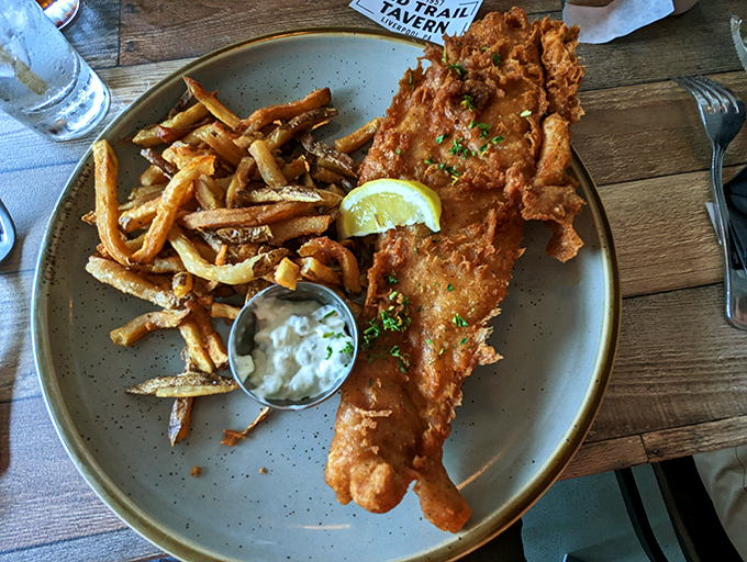 Fish and chips that would make a British pub regular nod in approval &ndash; crispy exterior, flaky interior, and hand-cut fries.