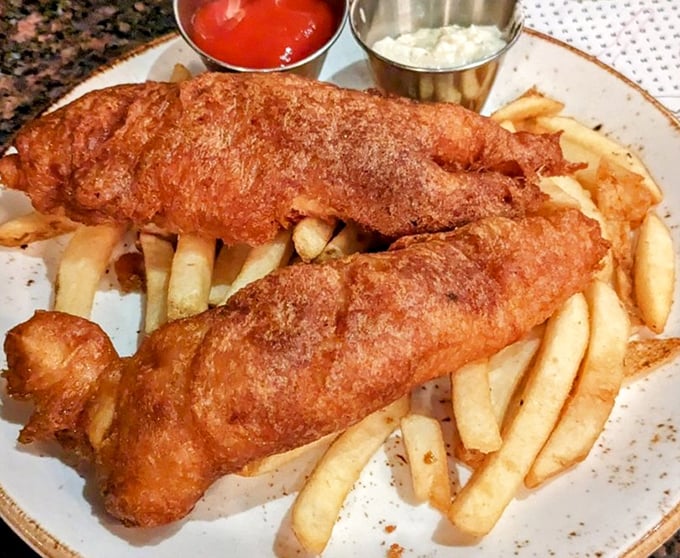 Fish and chips so golden and crispy, they make the perfect crunch sound that should be trademarked as "the symphony of satisfaction."