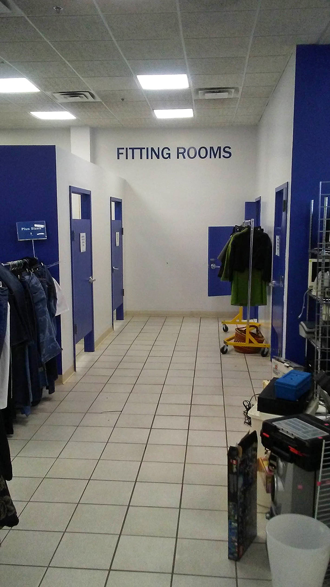 The fitting room area features Goodwill's signature blue doors, where that "maybe" purchase transforms into either "absolutely yes" or "perhaps next time."