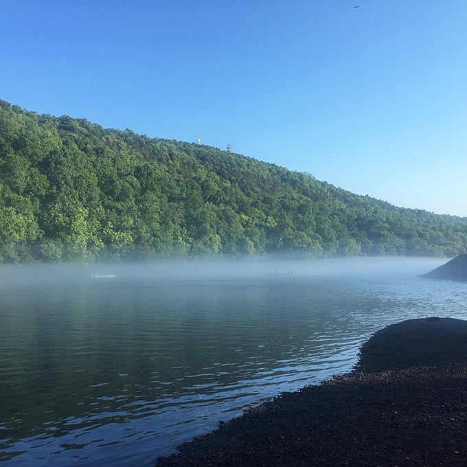 Morning fog dances across Bull Shoals Lake like nature's own special effect. Silence here is so complete you can almost hear the mist moving.