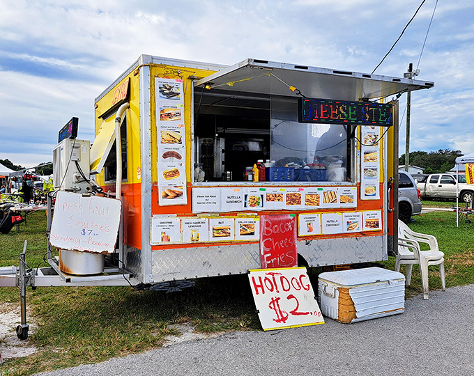 The universal siren call of a food truck promising hot dogs for two bucks—because serious treasure hunting requires serious refueling.