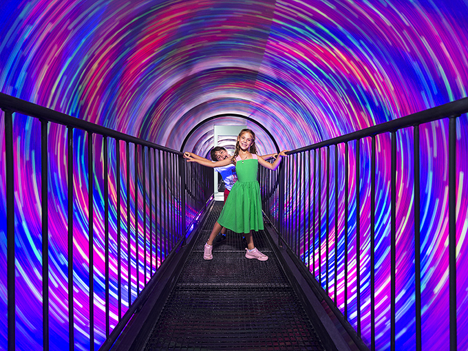 The vortex tunnel makes walking in a straight line feel like an Olympic event. Your brain insists you're spinning while your feet remain stubbornly on solid ground.